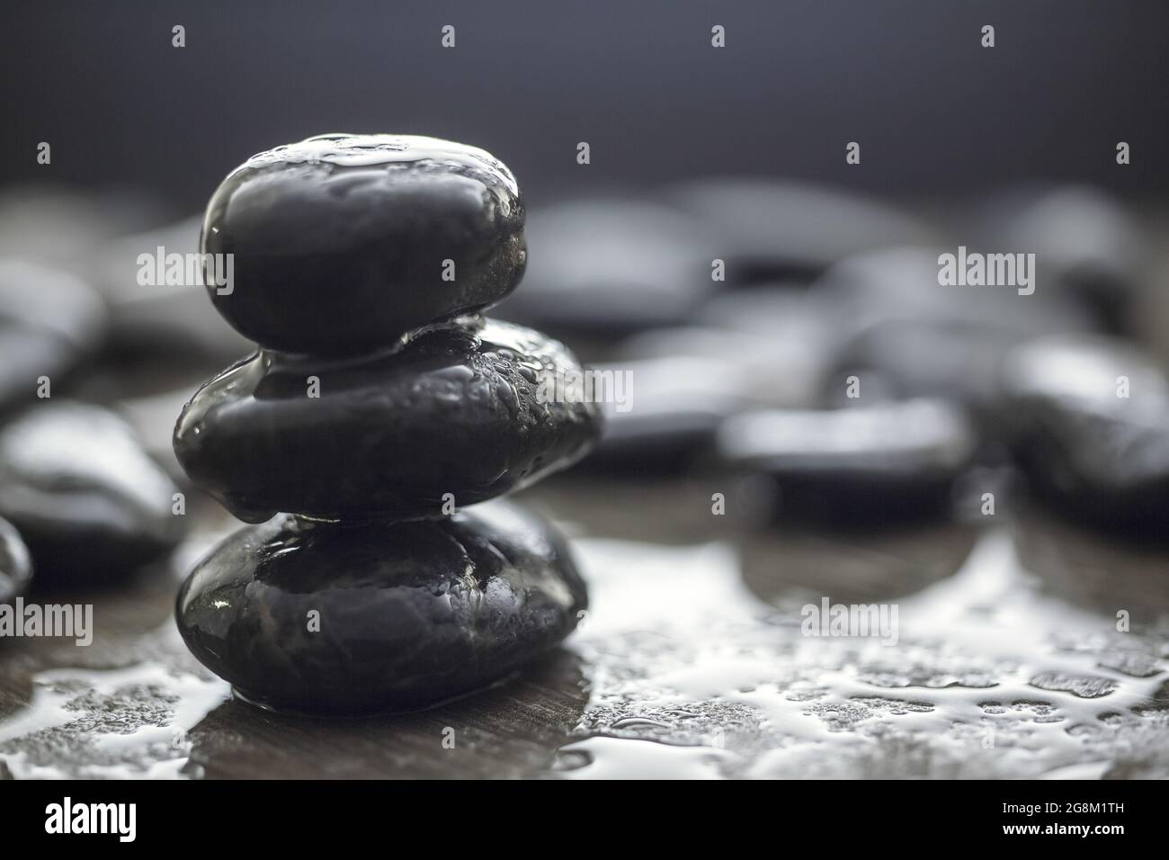 Closeup shot of wet rocks on a blurred background Stock Photo - Alamy