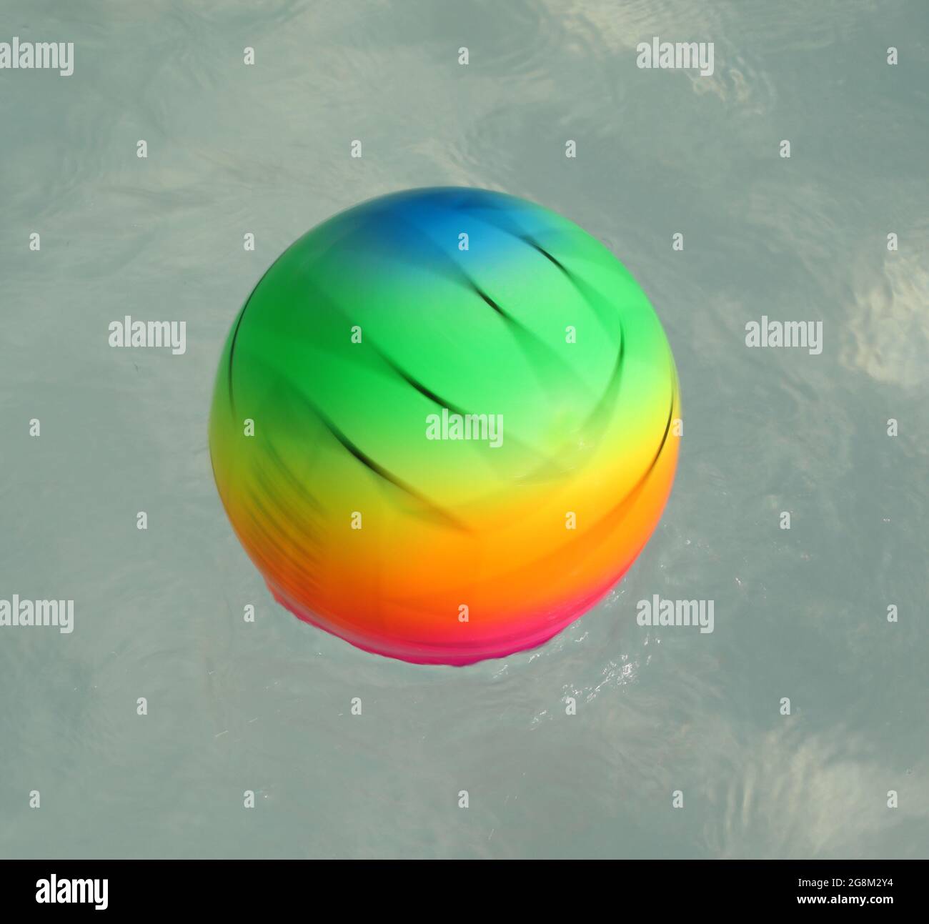 colorful multicolored ball that rotates in the pool during games in the ...