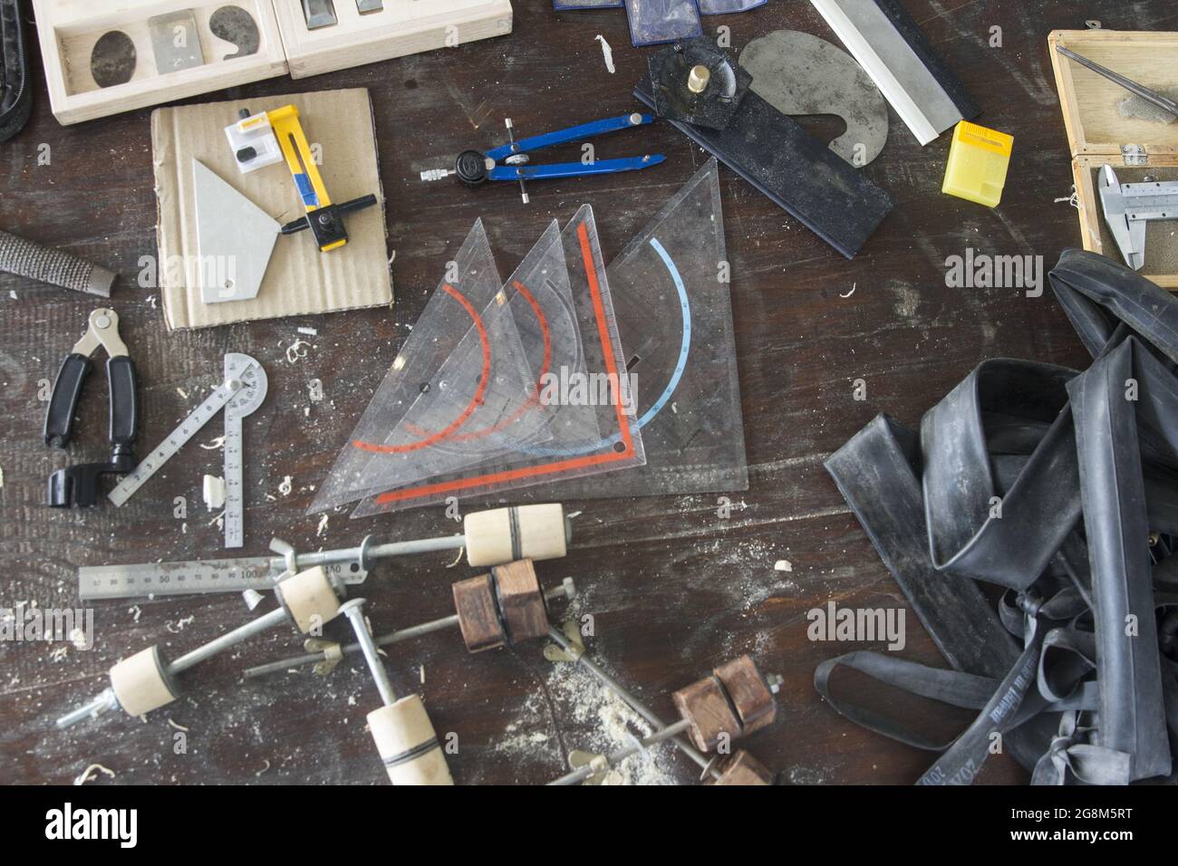 Top view of cutting and polishing tools with rulers on the table in the ...