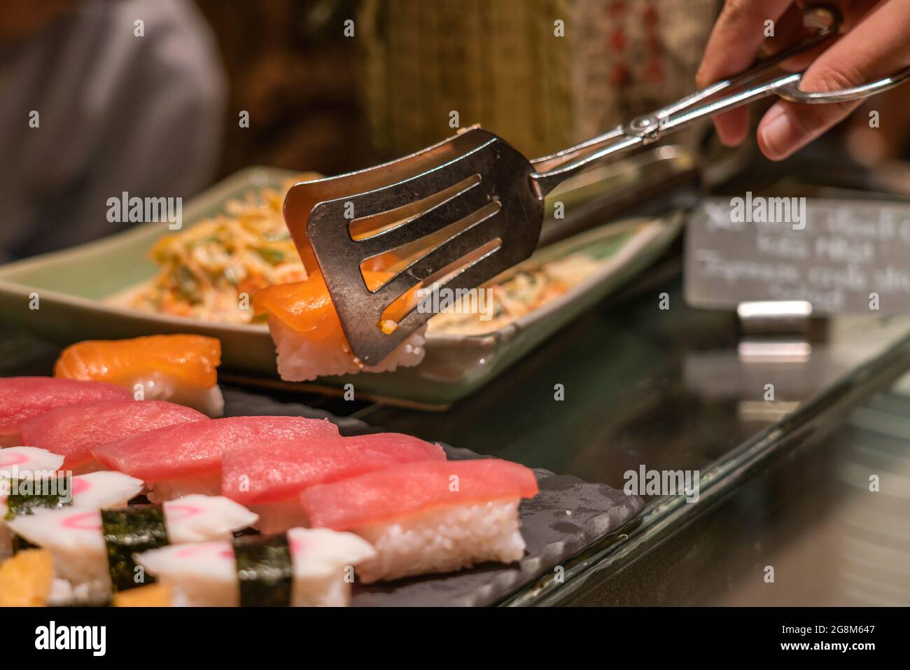Salmon Sashimi sushi in the Japanese buffet Stock Photo - Alamy