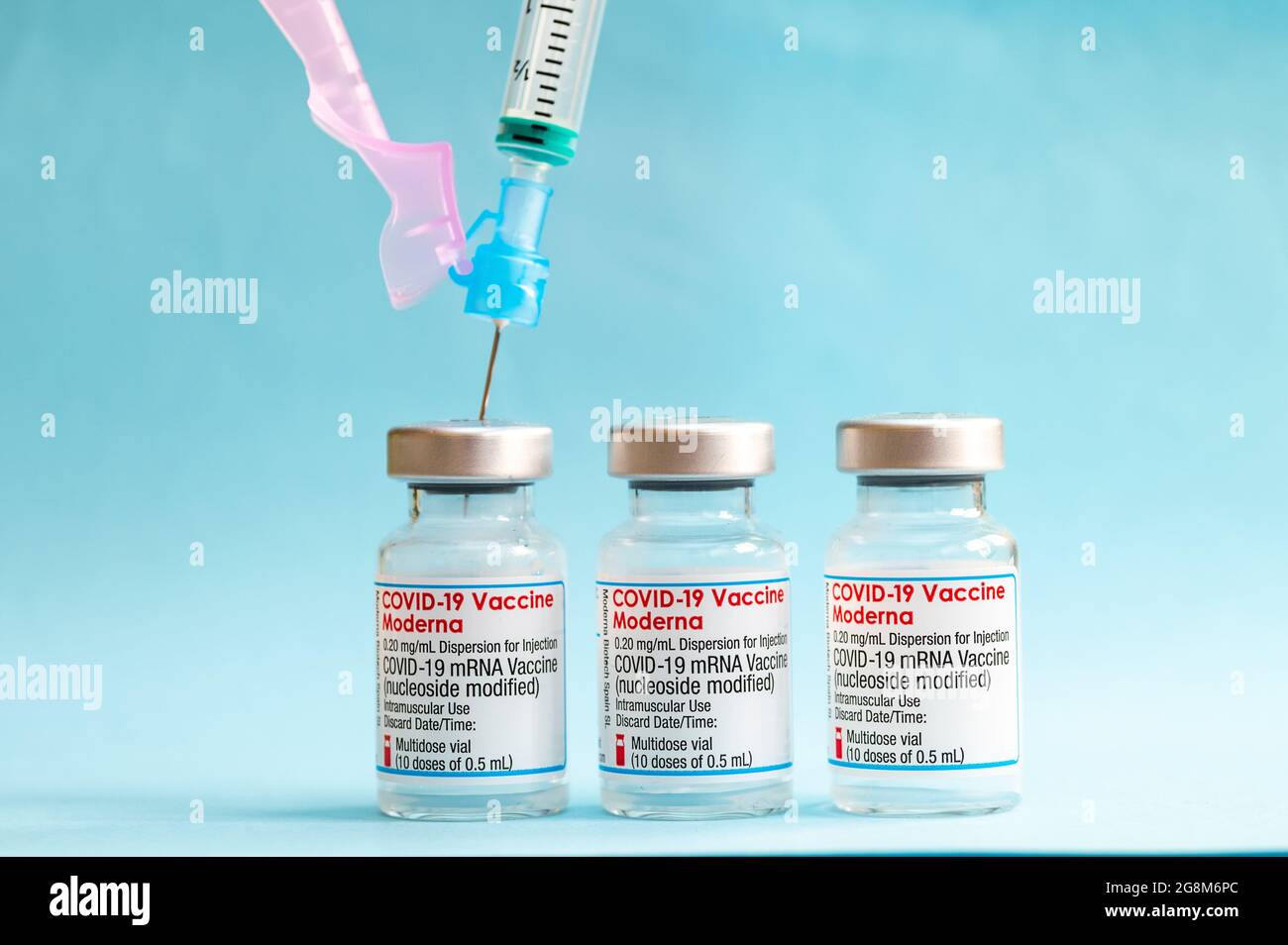 Vials of Moderna vaccine (COVID-19 mRNA, nucleoside modified) with a ...