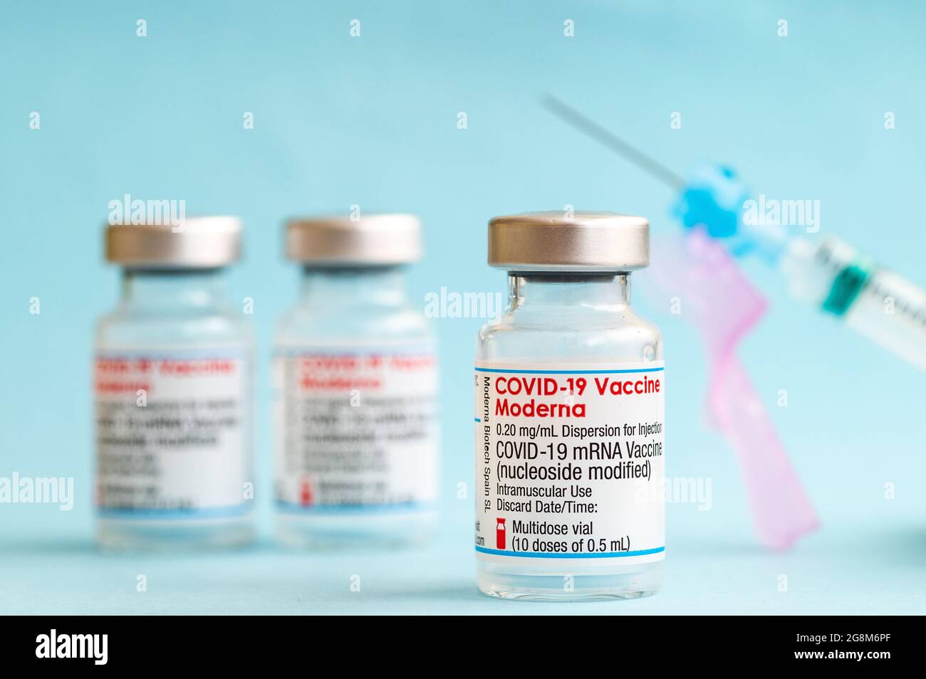 Vials of Moderna vaccine (COVID-19 mRNA, nucleoside modified) with a ...