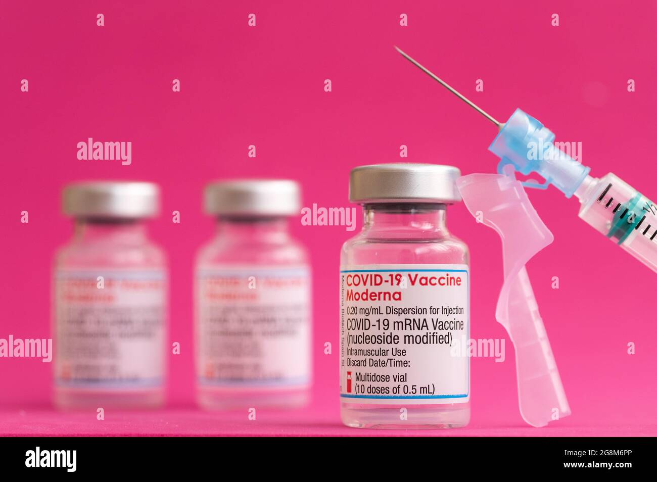 Vials of Moderna vaccine (COVID-19 mRNA, nucleoside modified) with a ...