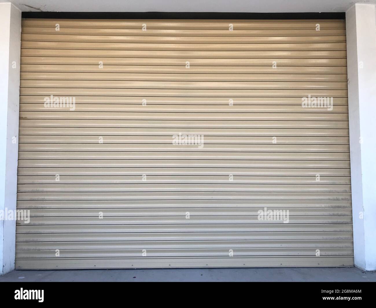 Beige color Mechanic or Hydraulic operated rolling shutter for an shop ...