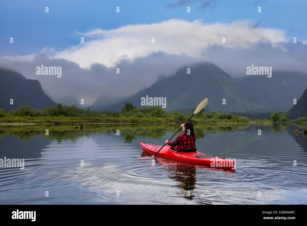 Adventure Caucasian Adult Woman Kayaking in Red Kayak Stock Photo - Alamy