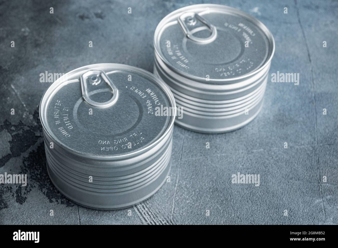 Canned sauce tin can, on gray background Stock Photo - Alamy