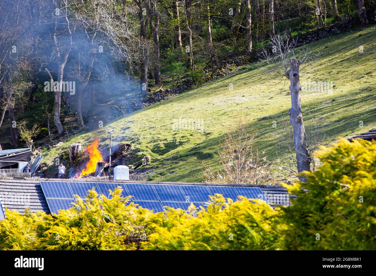 Burning waste and solar panels, Ambleside, UK Stock Photo - Alamy