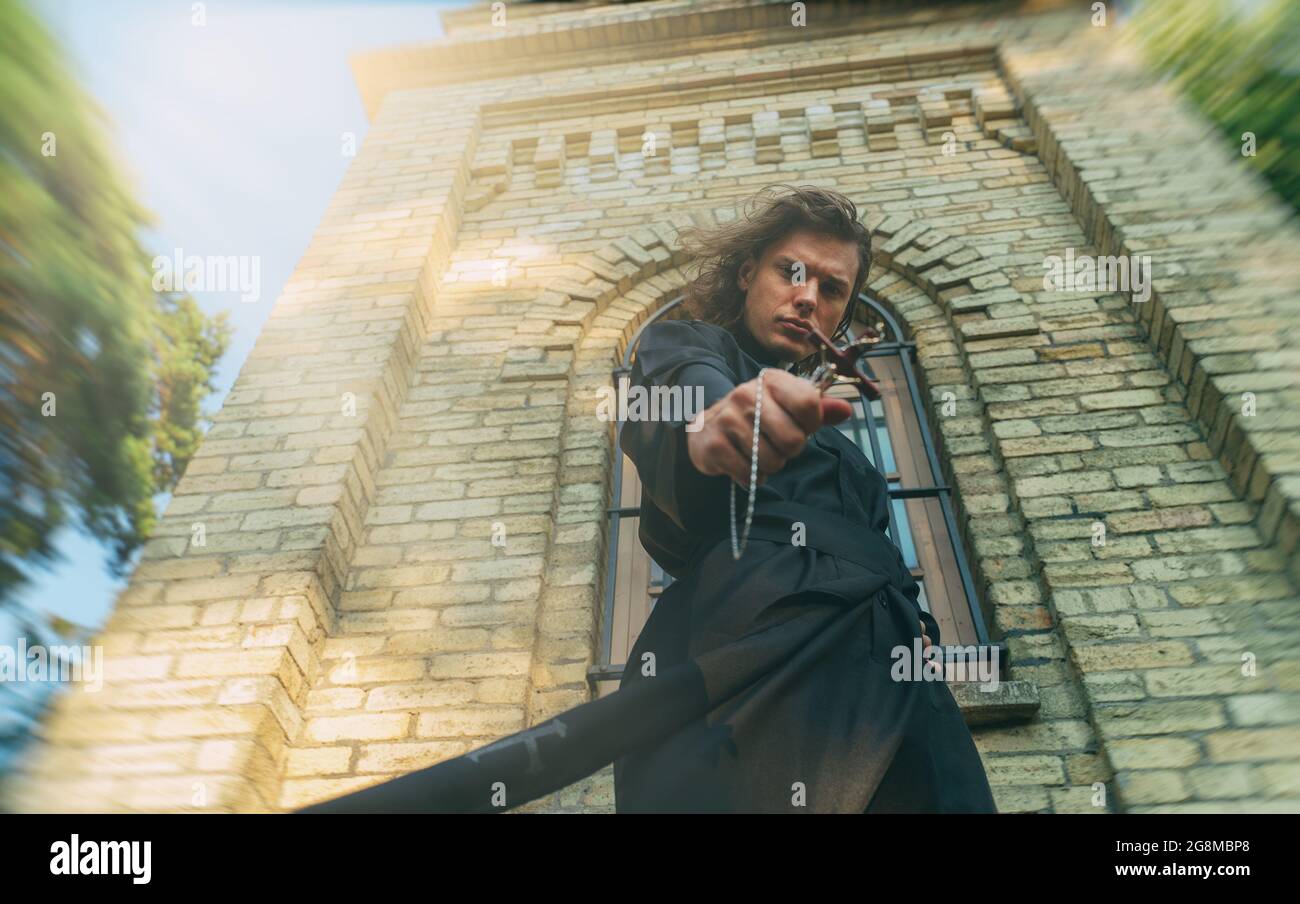 Christian priest with cross doing sermon by the church Stock Photo - Alamy