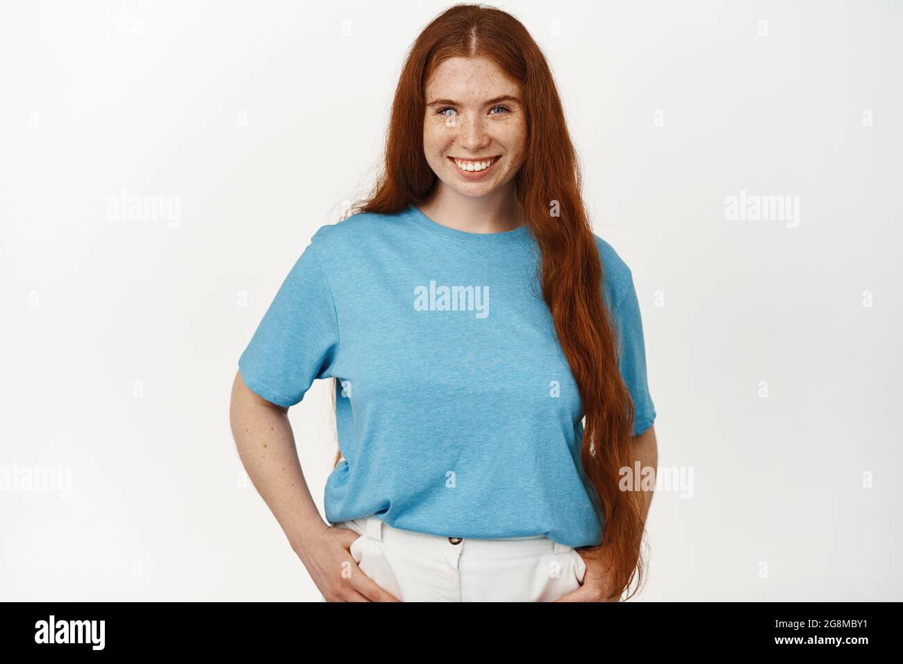 Young people. Happy ginger girl, woman with long natural red hair ...