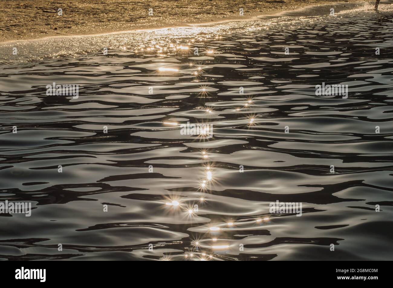 sea background at sunset ,reflection of sunlight as stars.copy space ...