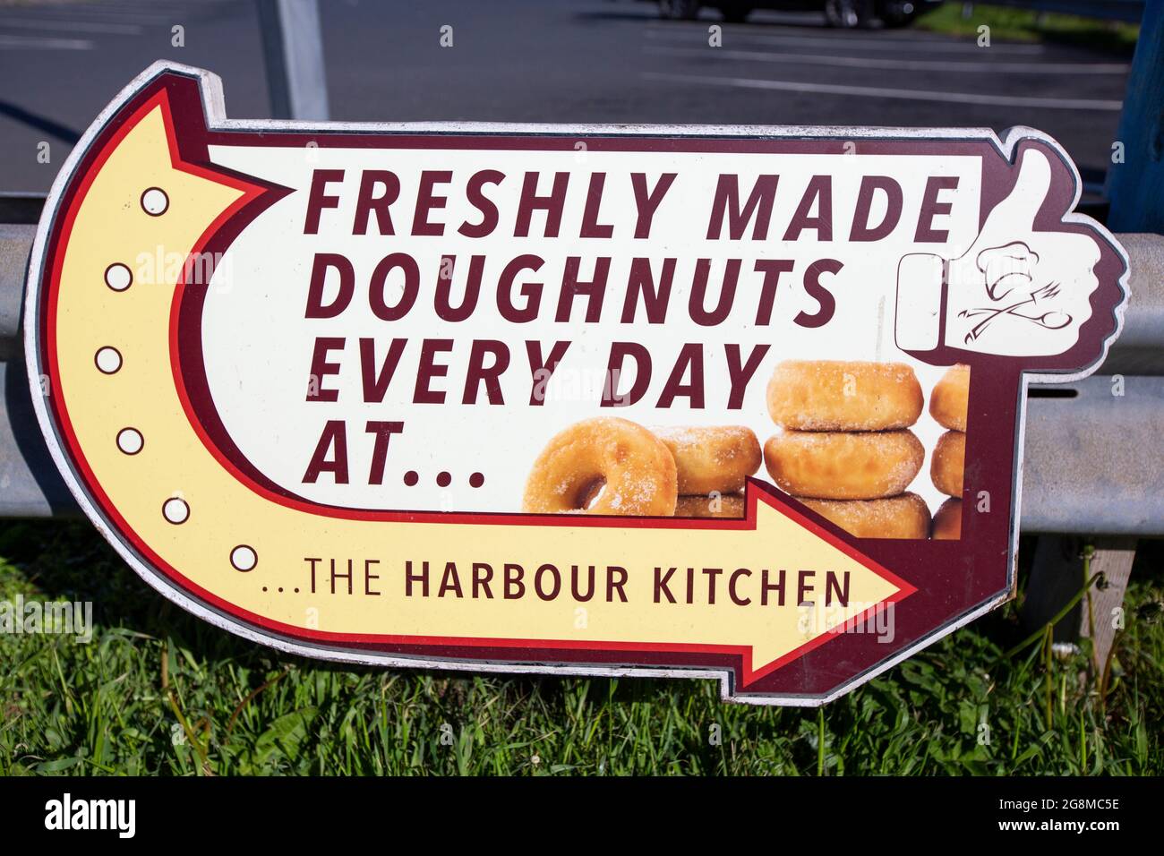 A sign for doughnuts at Seahouses harbour, Northumberland, UK Stock ...