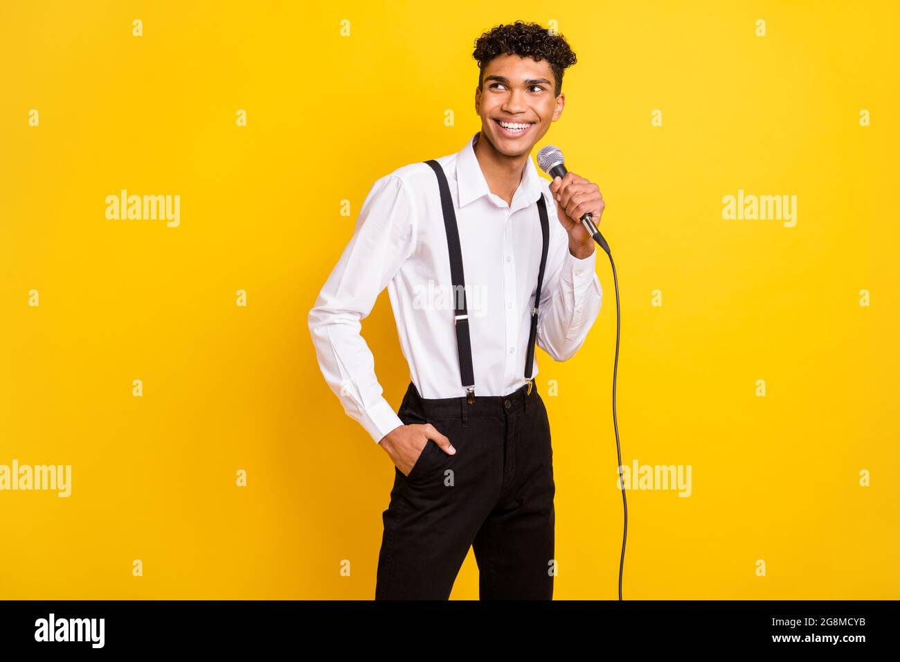 Photo portrait of african american stand-up comedian holding microphone ...