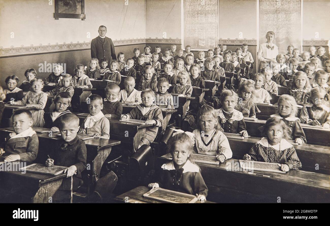 Classmates in the classroom. Children and teacher in the school ...