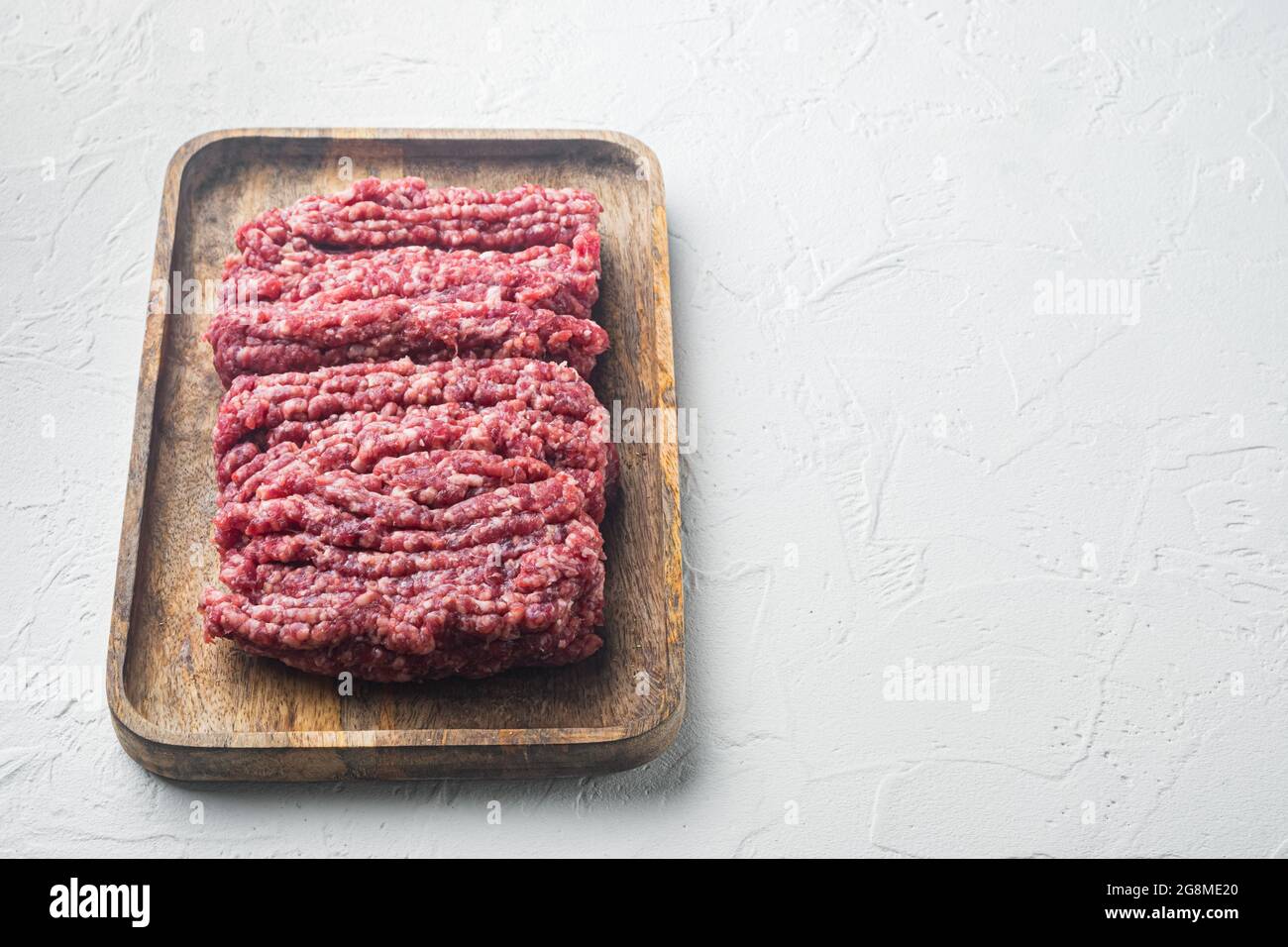 Fresh minced meat, ground beef, on white background with copy space for ...