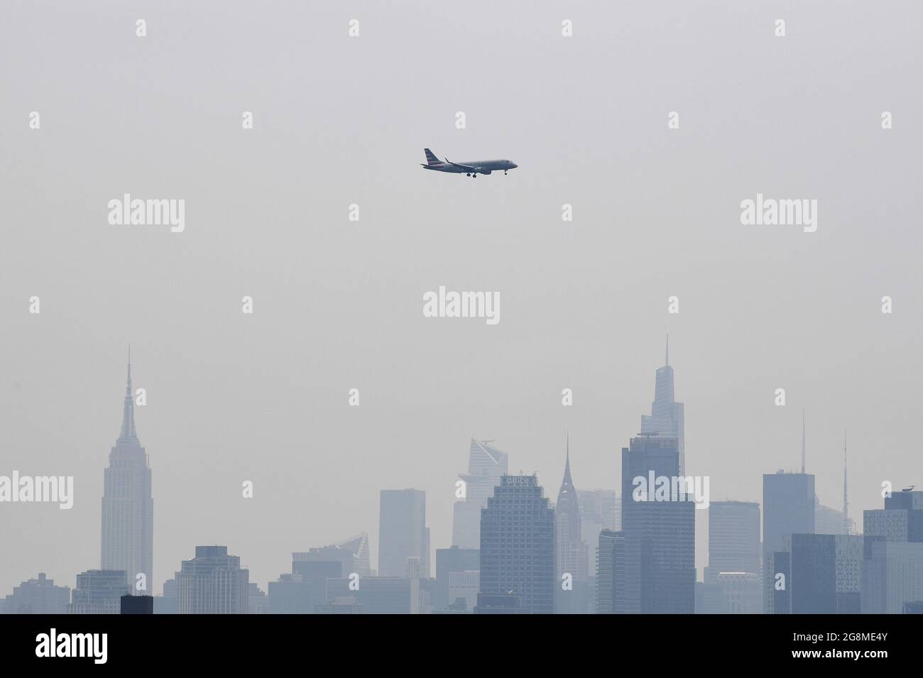 New York, USA. 21st July, 2021. A passenger plane approaches for a ...