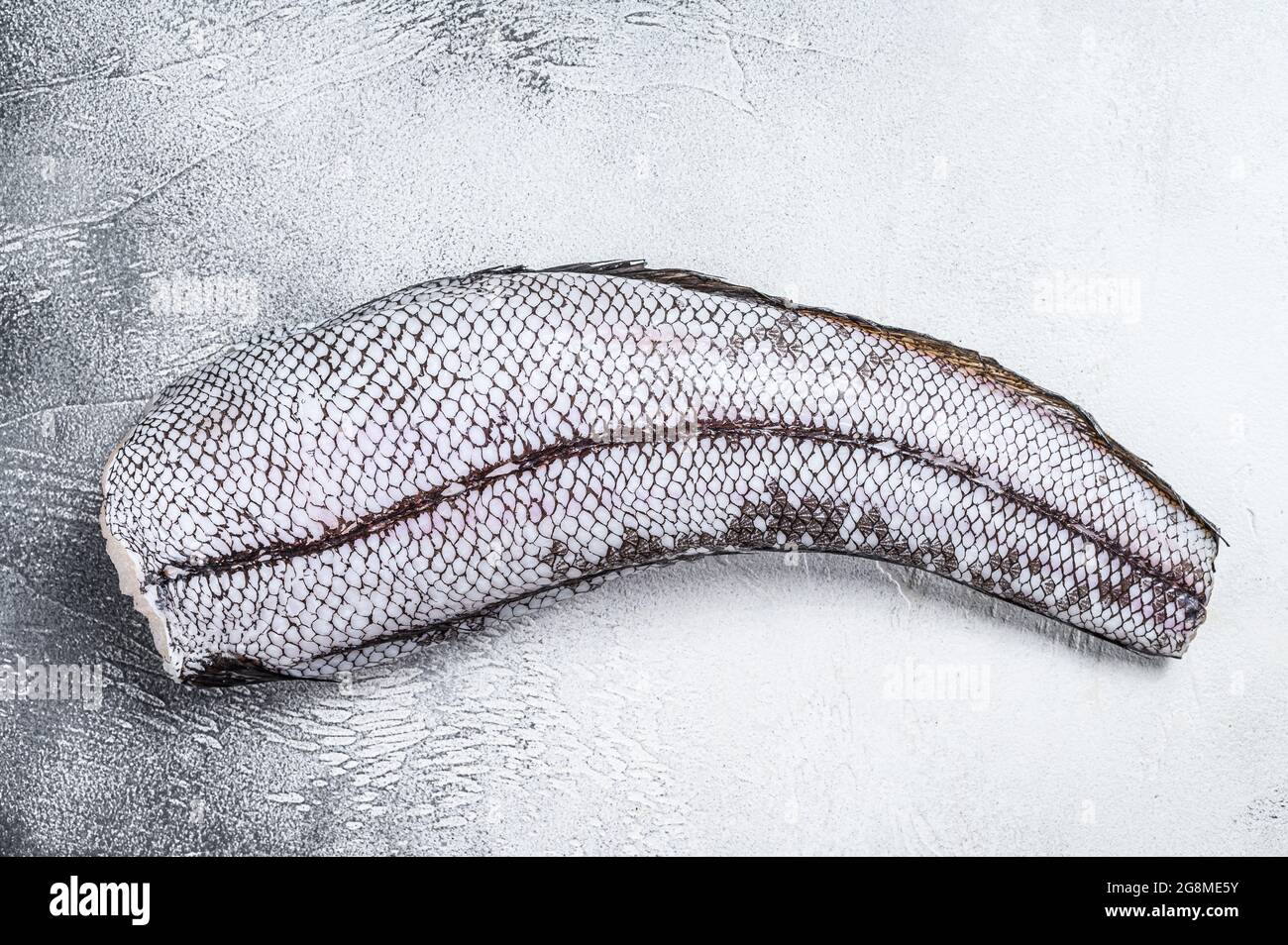 Raw grenadier macrurus fish. White background. Top view Stock Photo - Alamy