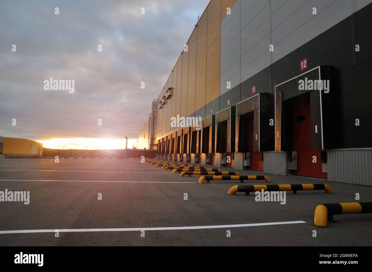 Warehouse logistics complex in the rays of the rising sun Stock Photo ...