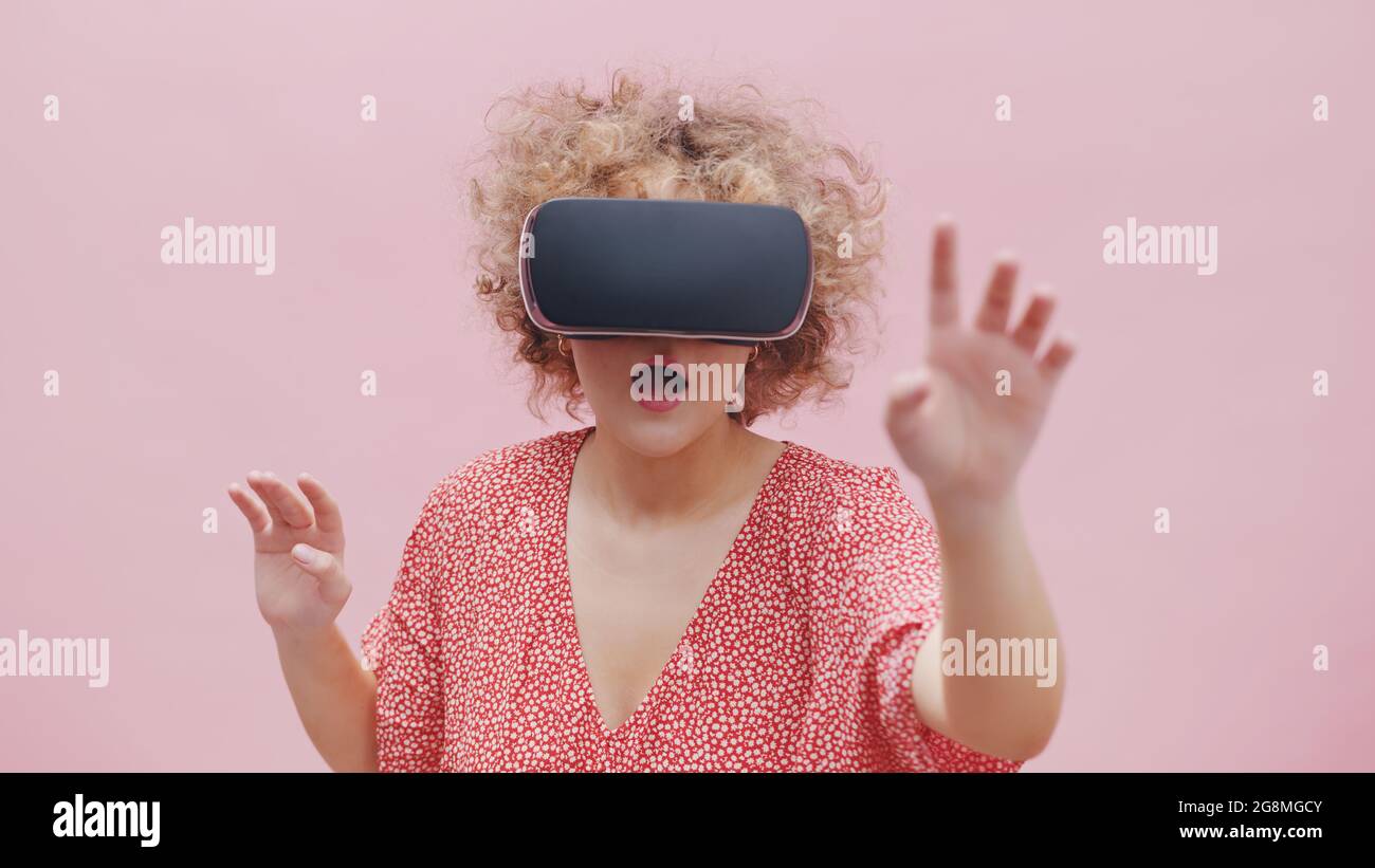 Girl wearing Virtual Reality goggles VR Box watching a 3D movie ...