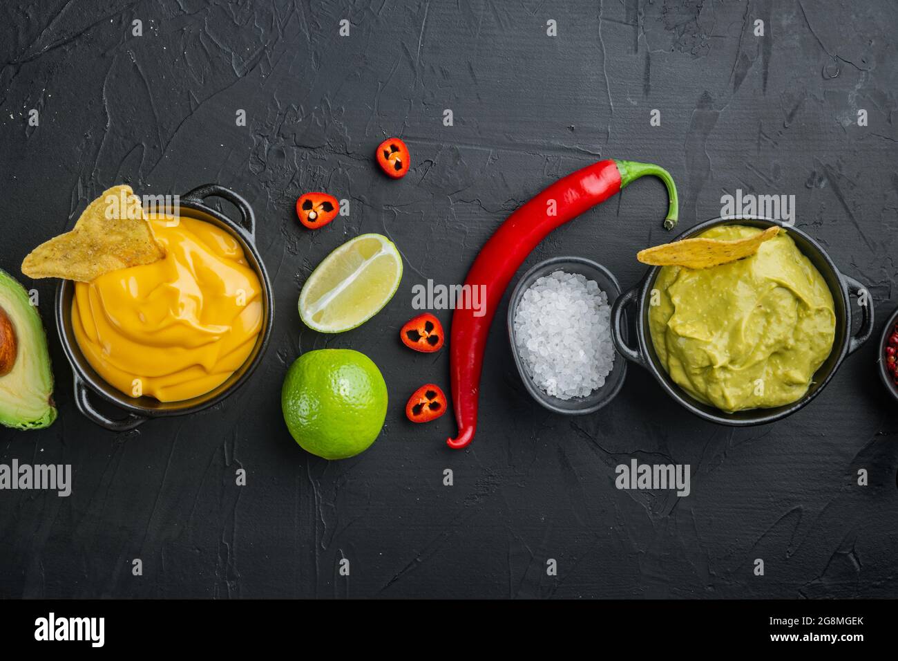 Green guacamole and yellow cheese dip sauce for traditional, Mexican ...