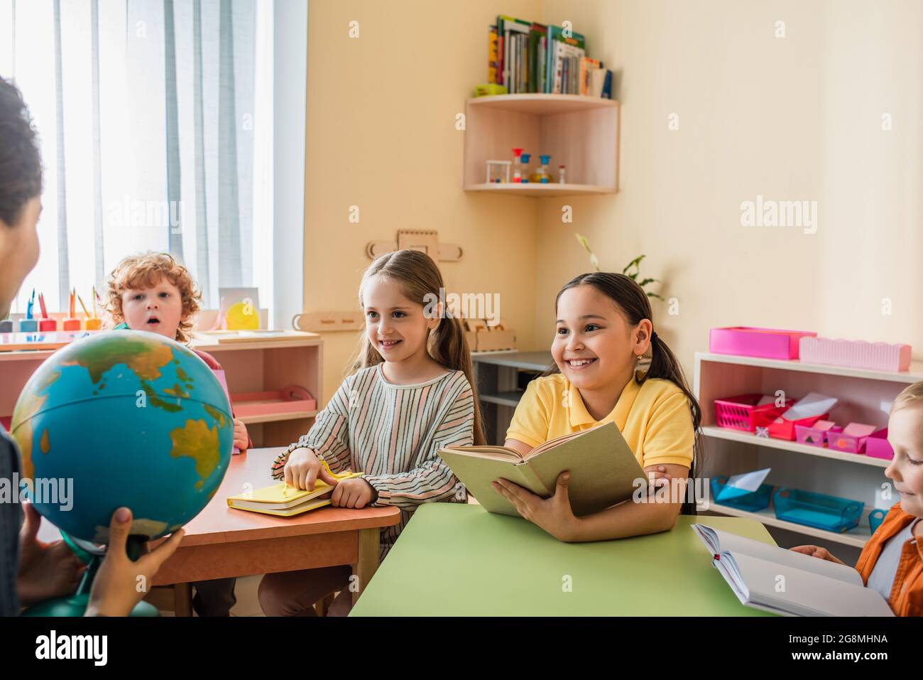 Elementary classroom and globe hi-res stock photography and images - Alamy