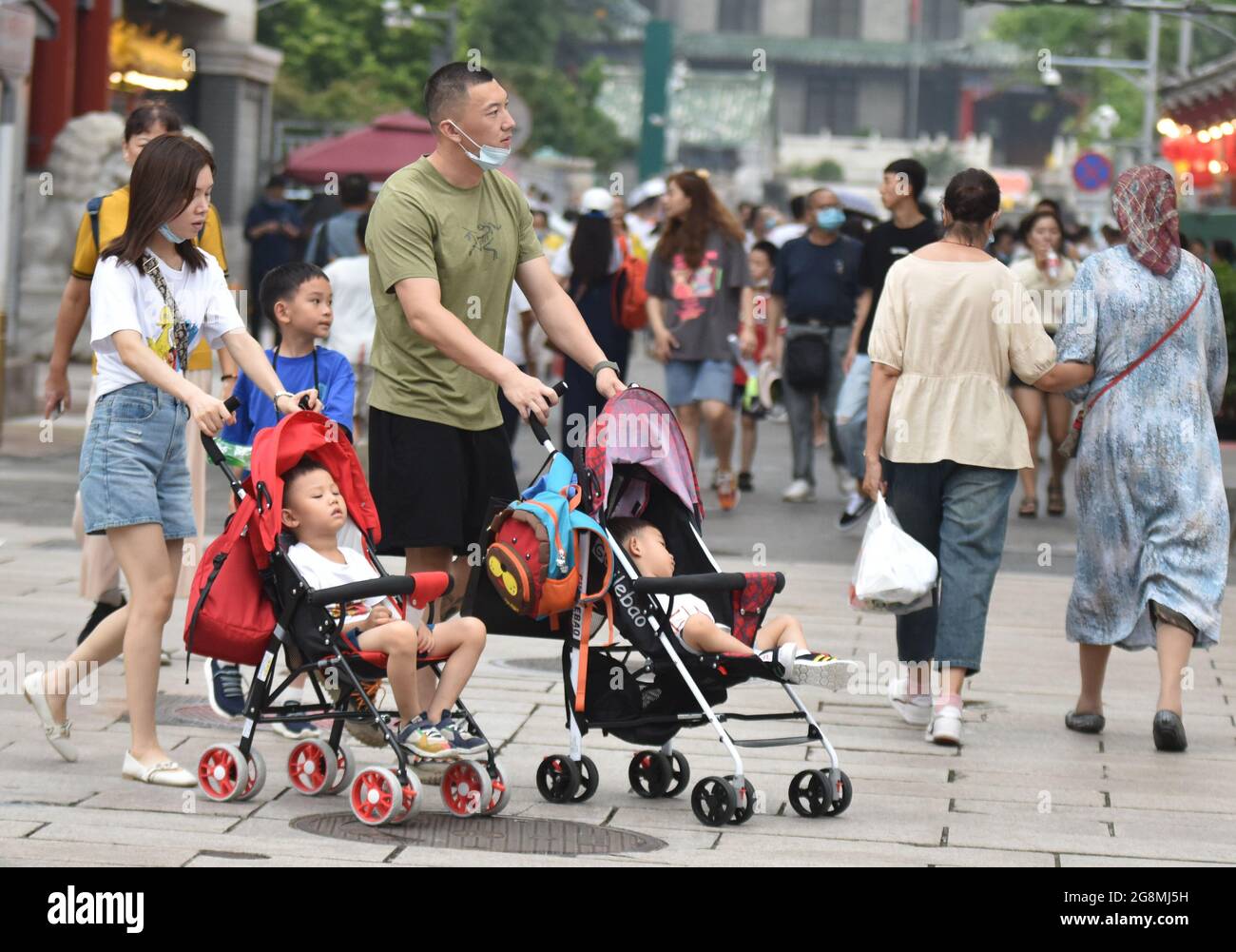 Parents take their children for a walk hi-res stock photography and ...