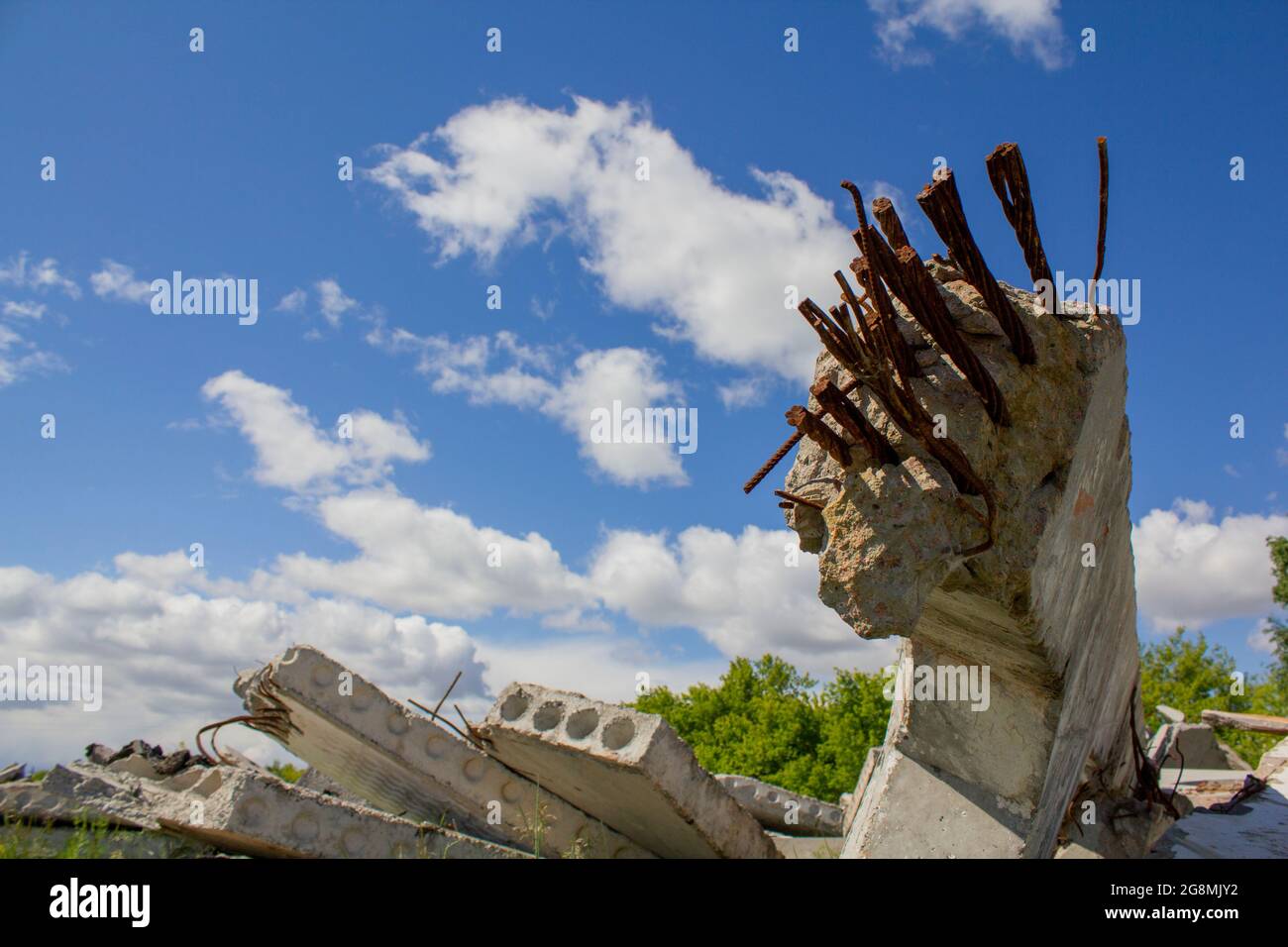 The destroyed building against the background of the blue sky. Broken ...