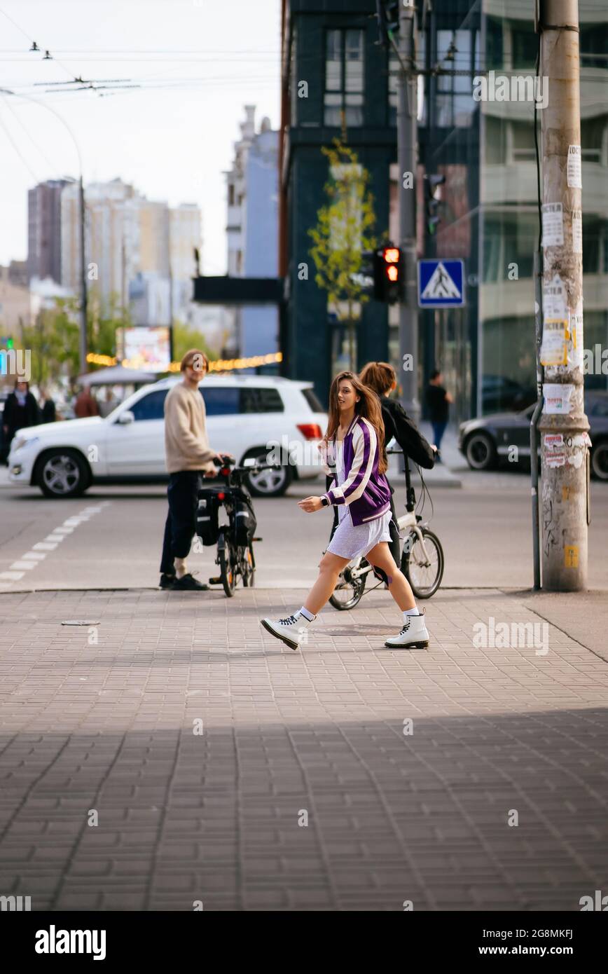 Pretty young woman, walking at the street Stock Photo - Alamy