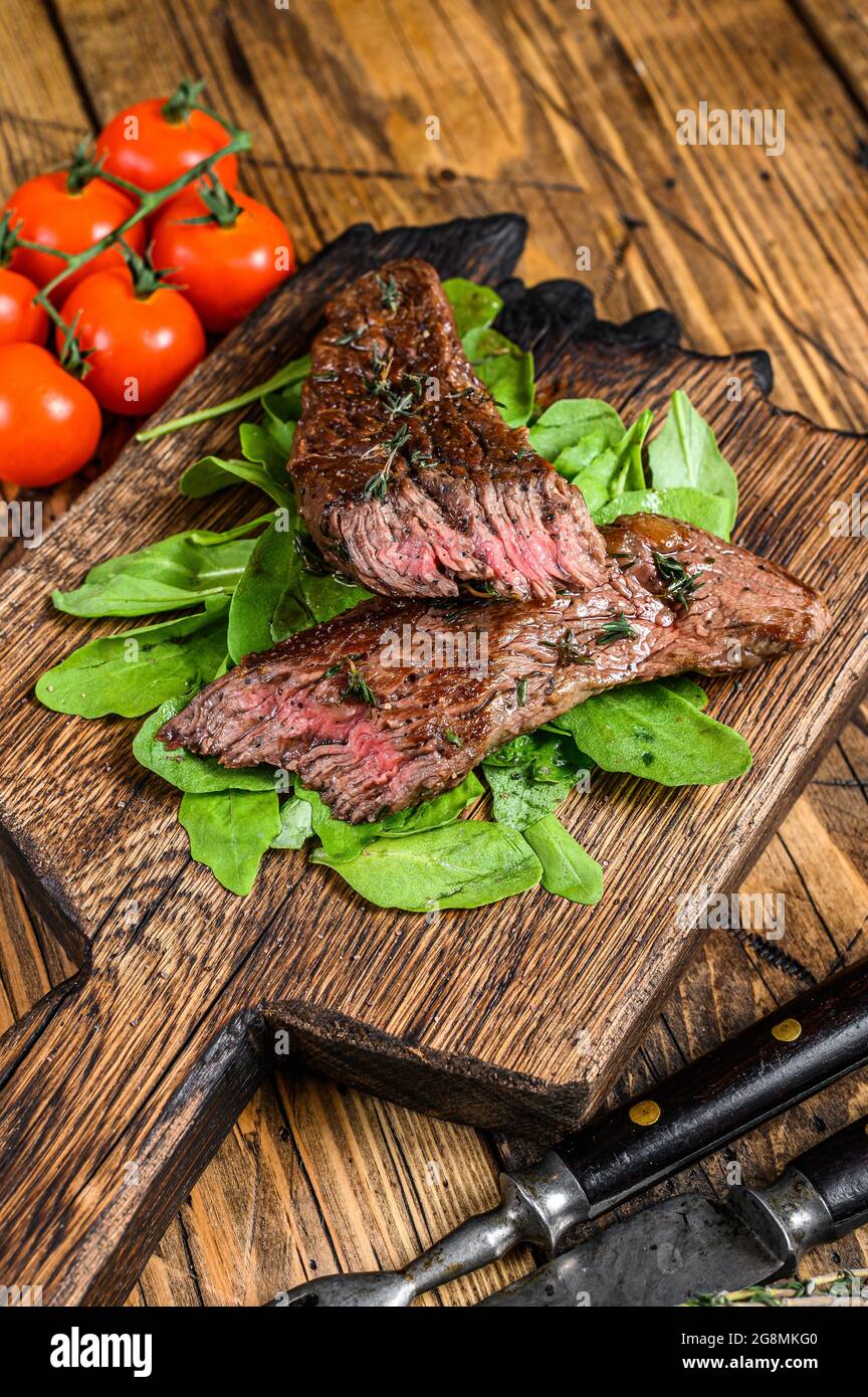 Grilled Cut Skirt machete meat beef Steak on a cutting board. wooden ...