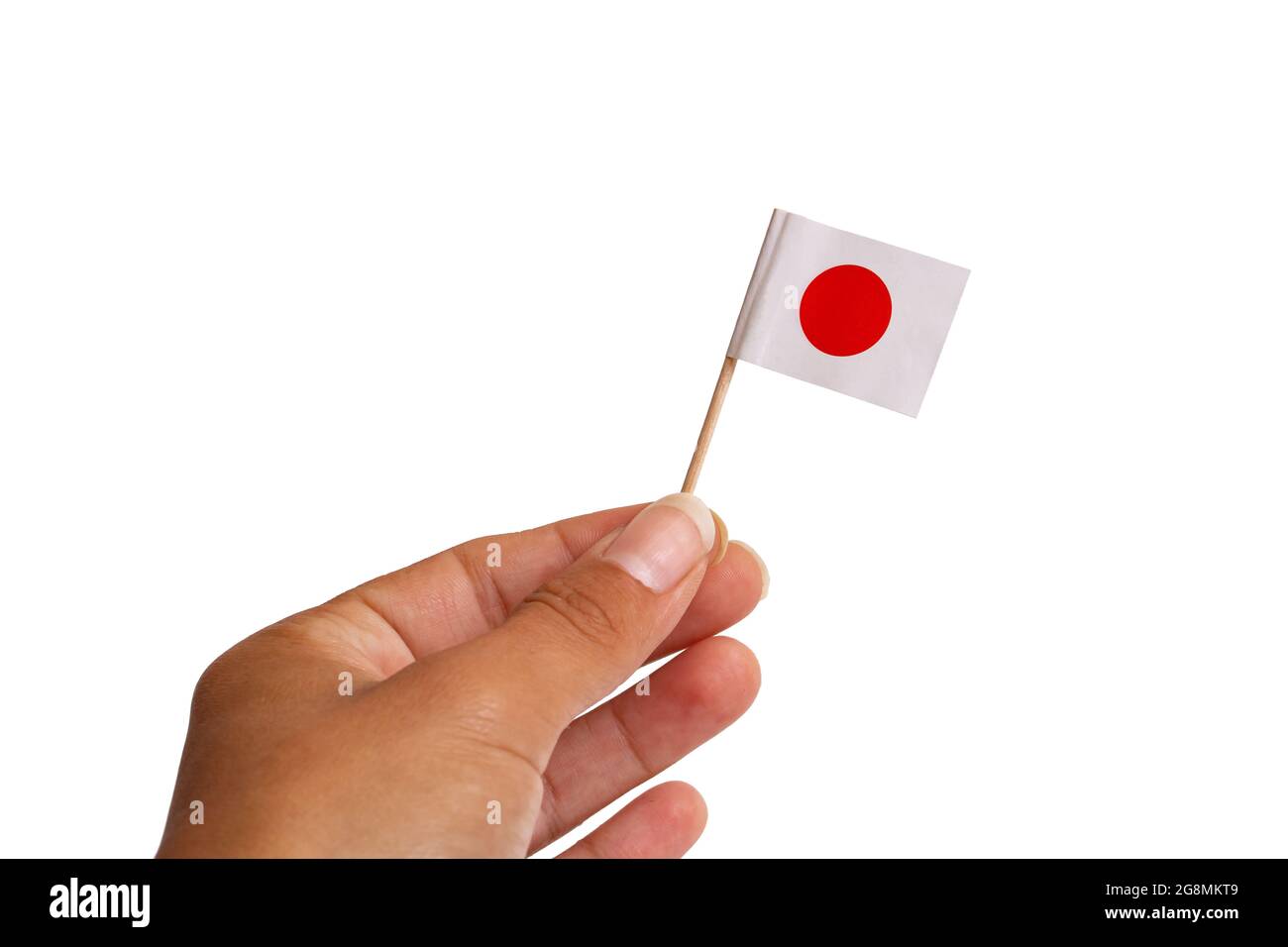 Small japanese flag in hand isolated on white background close up Stock ...