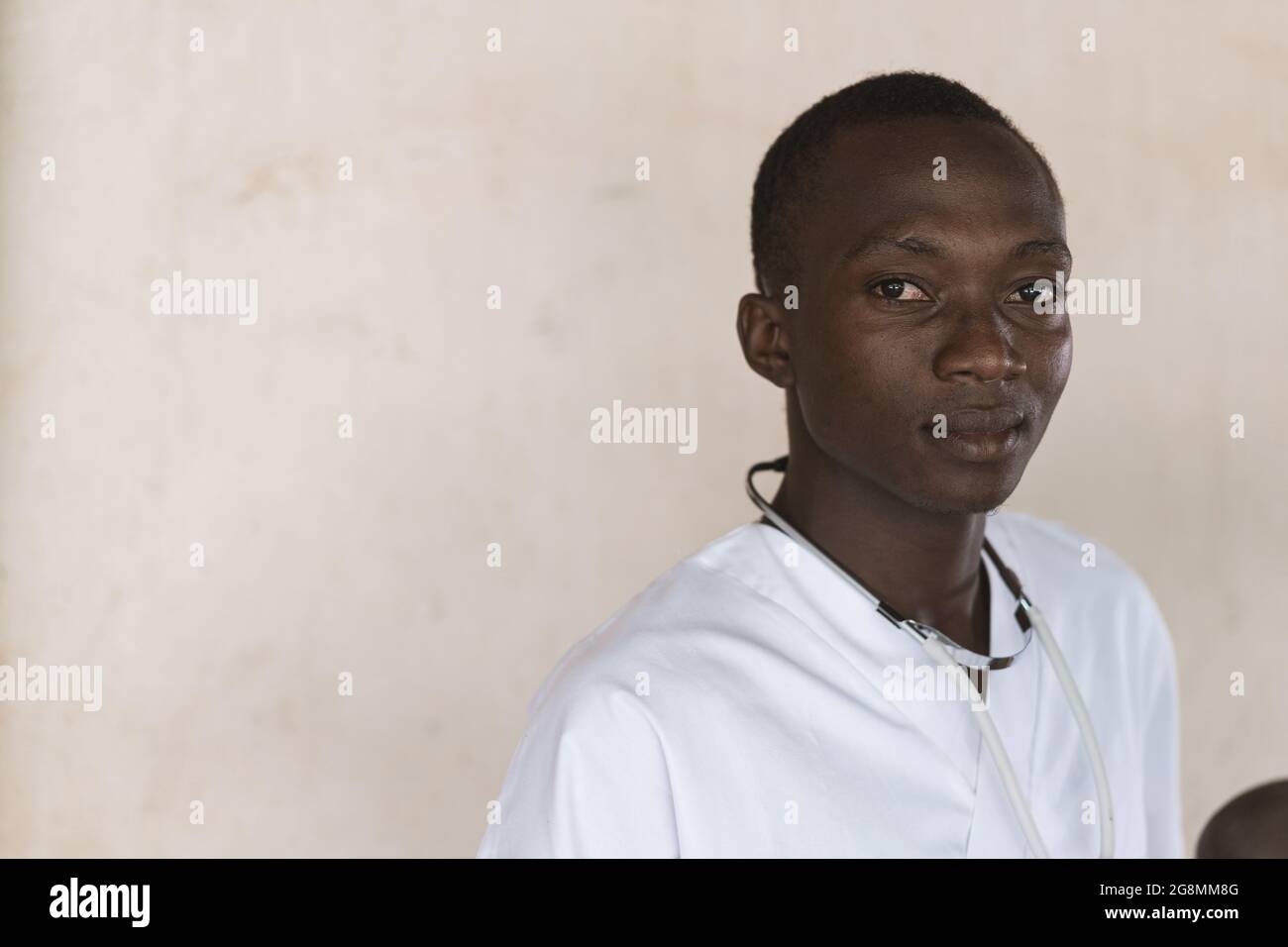 This is an image of a real African nurse working in his hospital in a ...