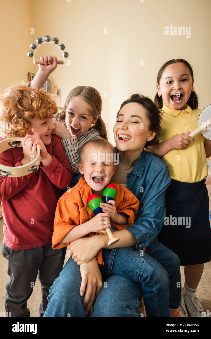 Children laughing teacher classroom hi-res stock photography and images ...