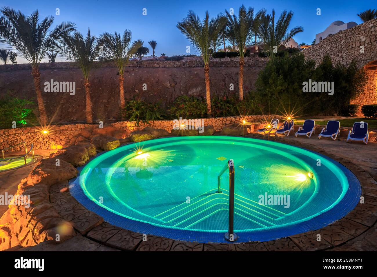 Evening view for luxury swimming pool in night illumination Stock Photo ...