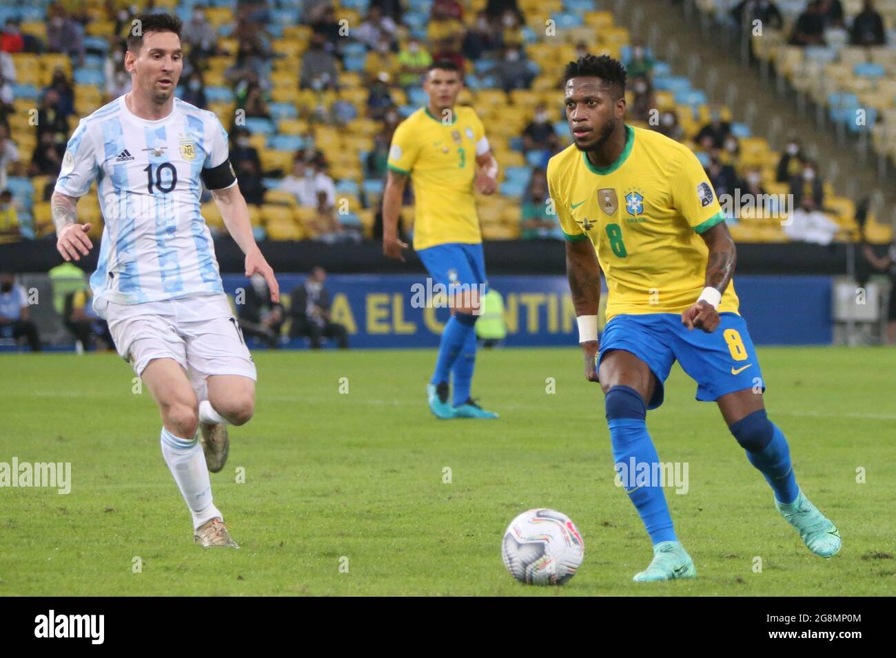 Lionel Messi of Argentina and Fred of Brazil During match between ...