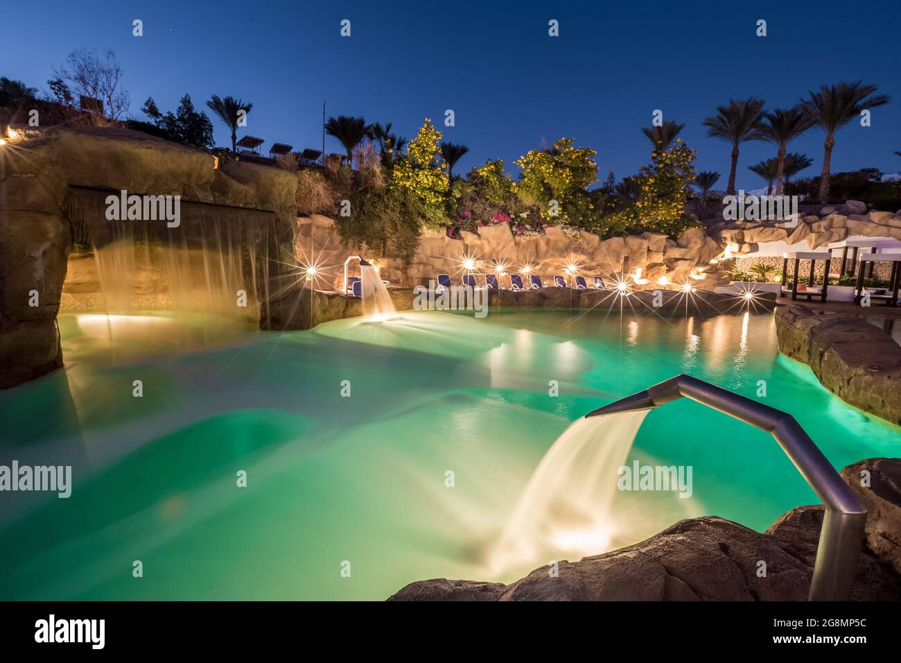 Evening view for luxury swimming pool in night illumination Stock Photo ...