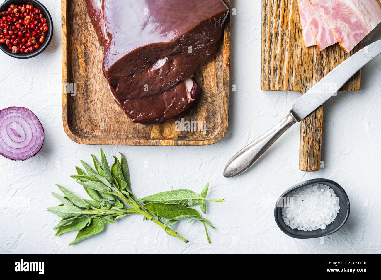 Beef liver with smoked bacon on white background, top view Stock Photo ...