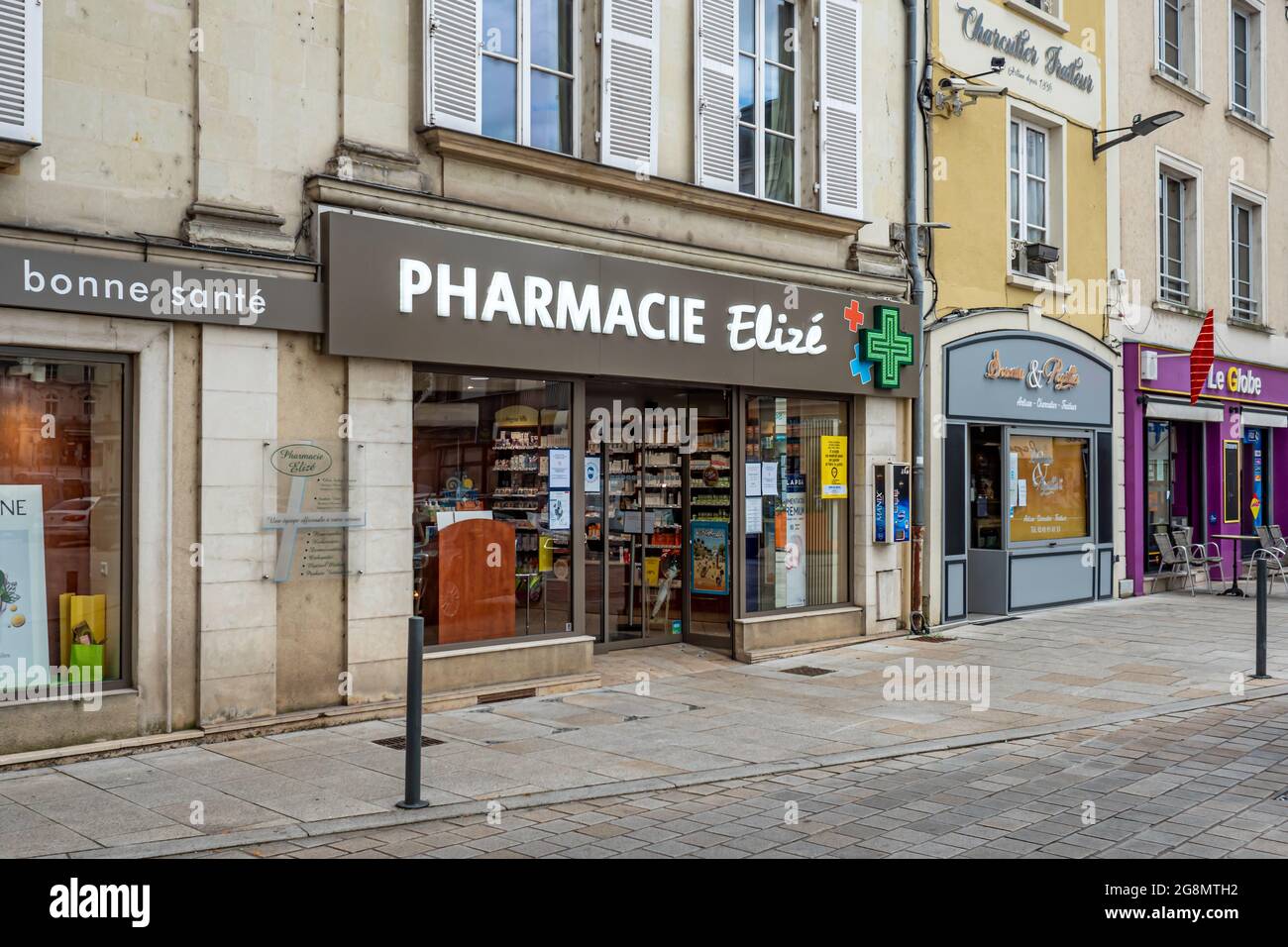 SABLE, FRANCE - Jul 12, 2021: The Elize pharmacy storefront on a busy ...