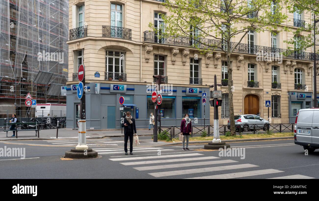 PARIS, FRANCE - Jul 12, 2021: The CIC storefront near a busy crosswalk ...