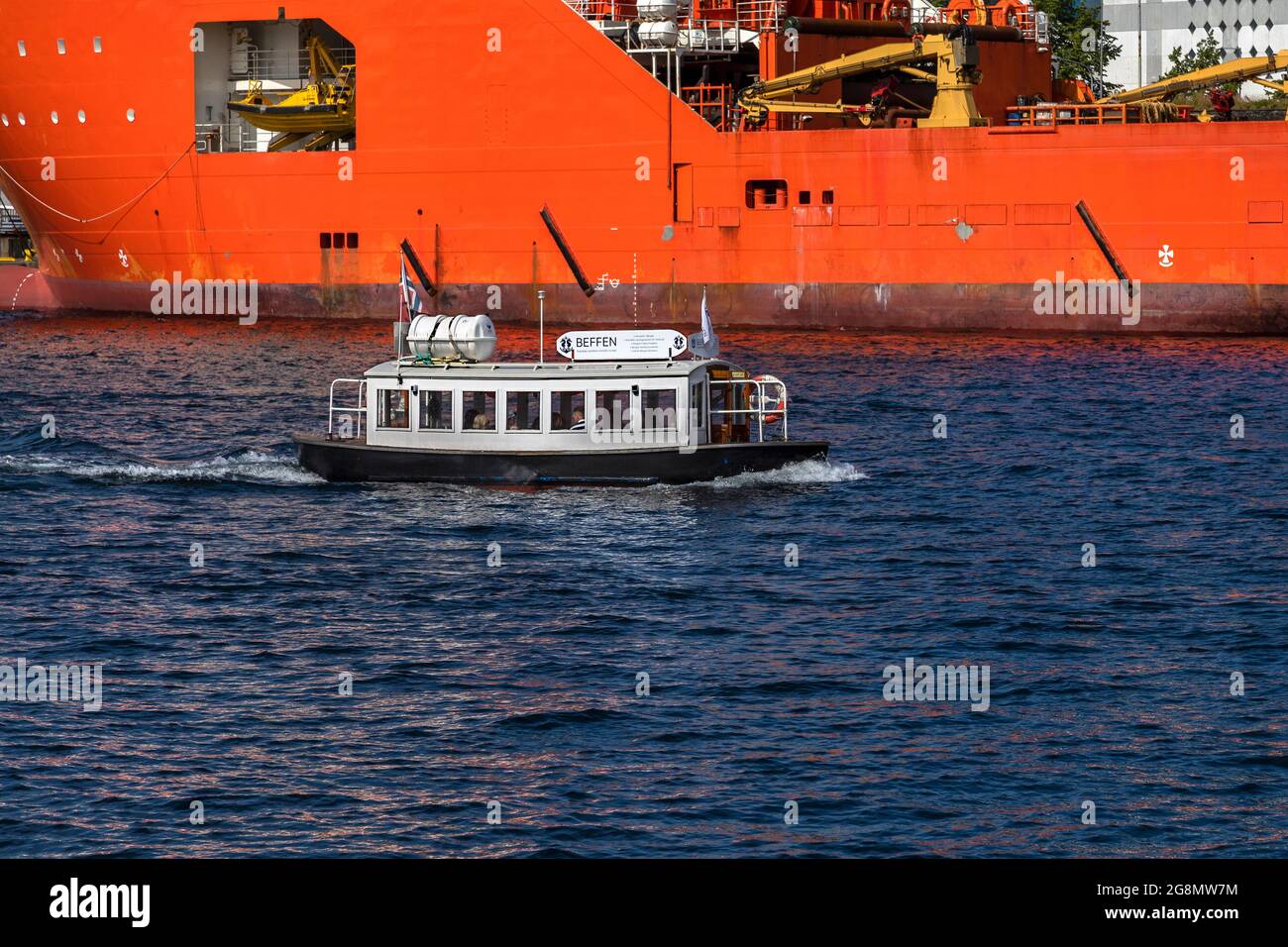 Snall harbor ferry Beffen arriving at Vaagen, in the port of Bergen ...