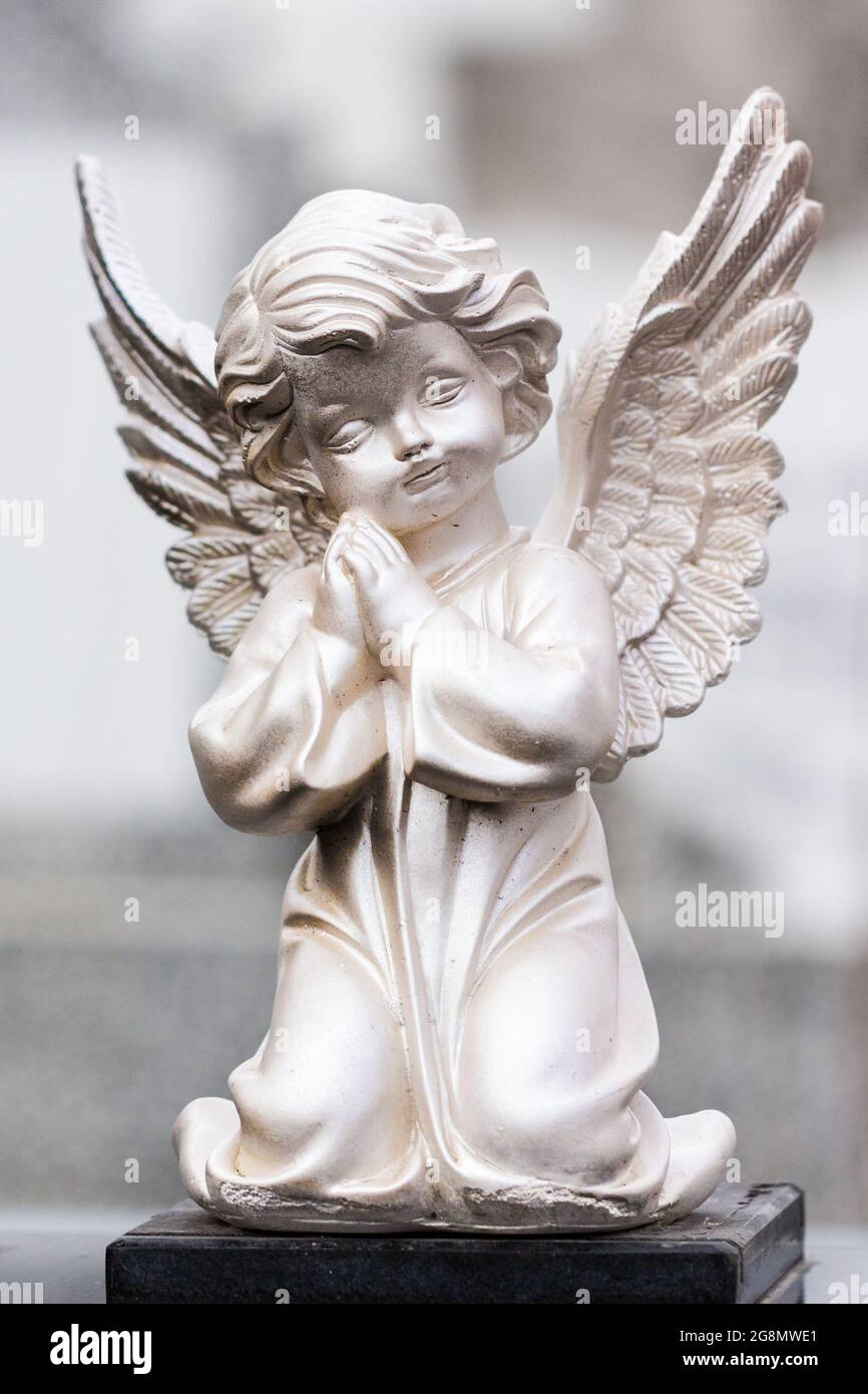 Small white angel hi-res stock photography and images - Alamy