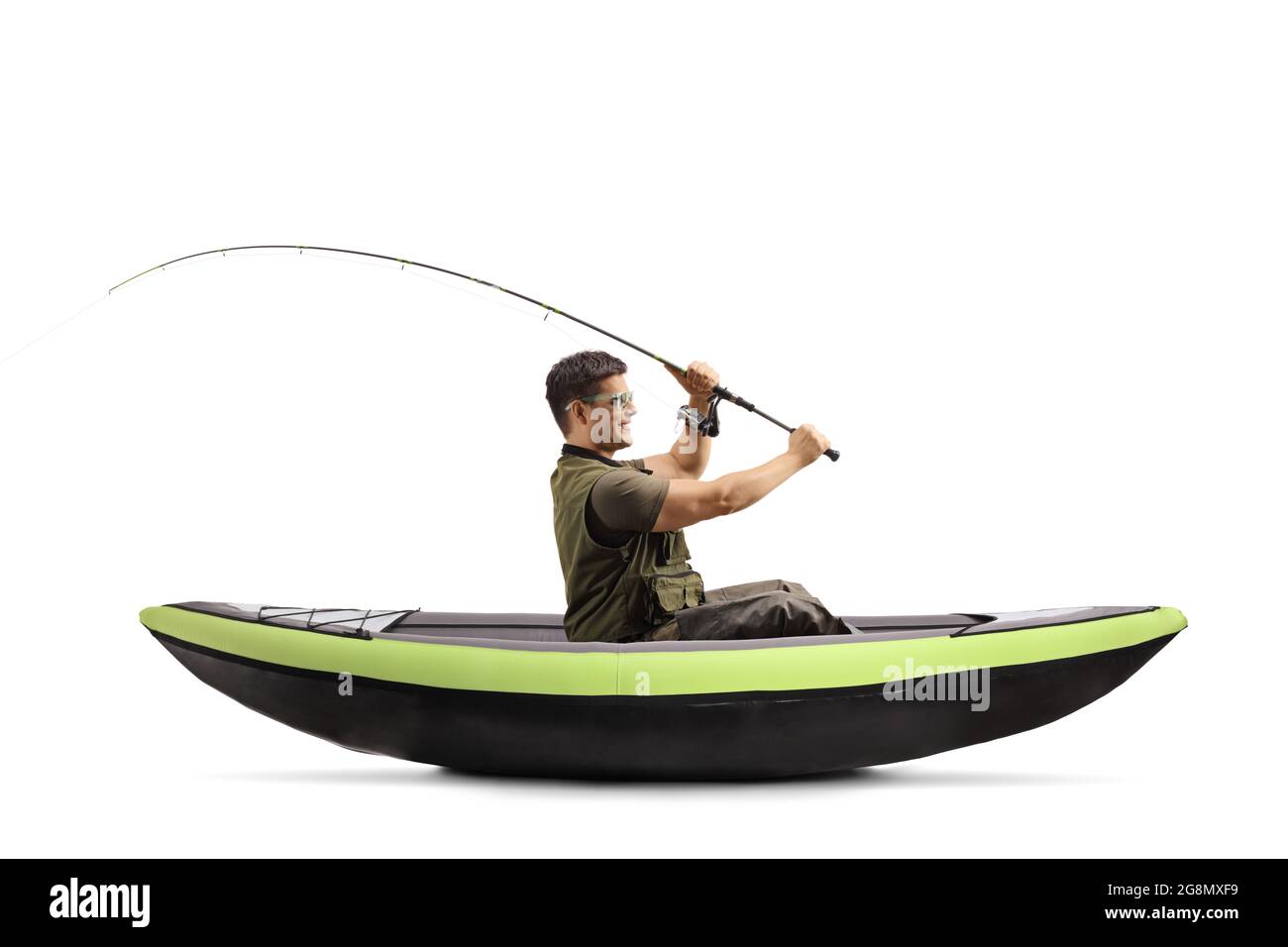 Fisherman throwing a fishing rod from a canoe isolated on white ...