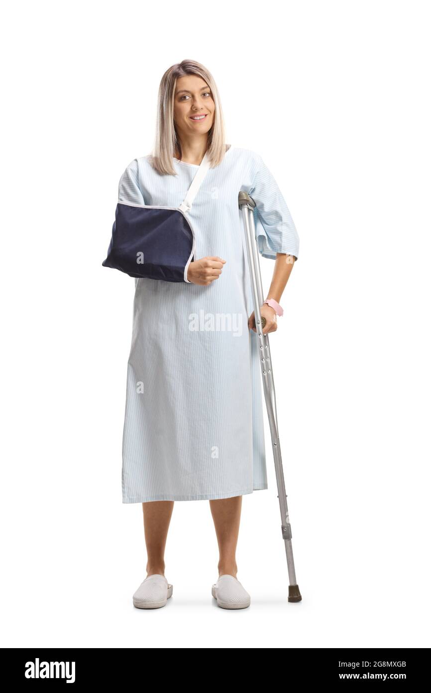 Full length portrait of a young female patient with a broken arm and a ...