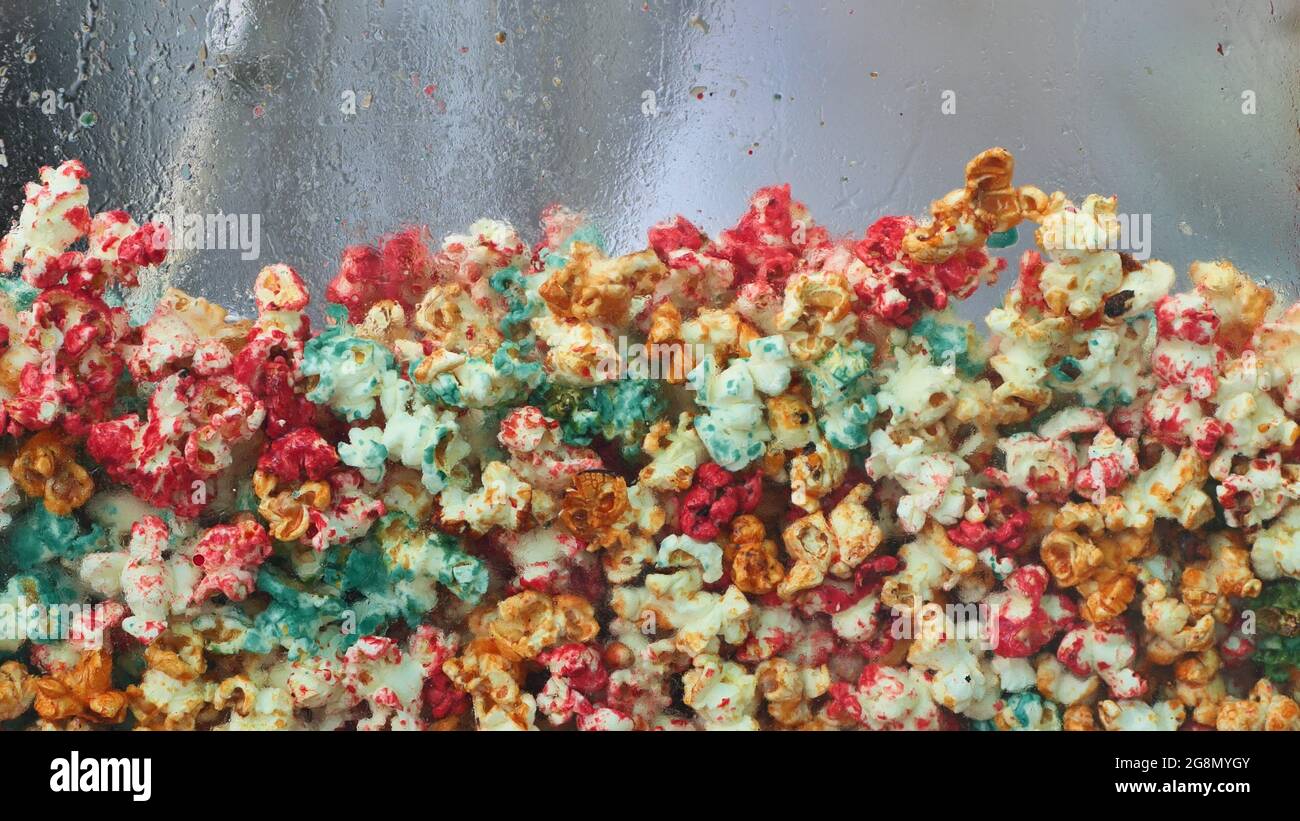 colored popcorn on white background Stock Photo - Alamy