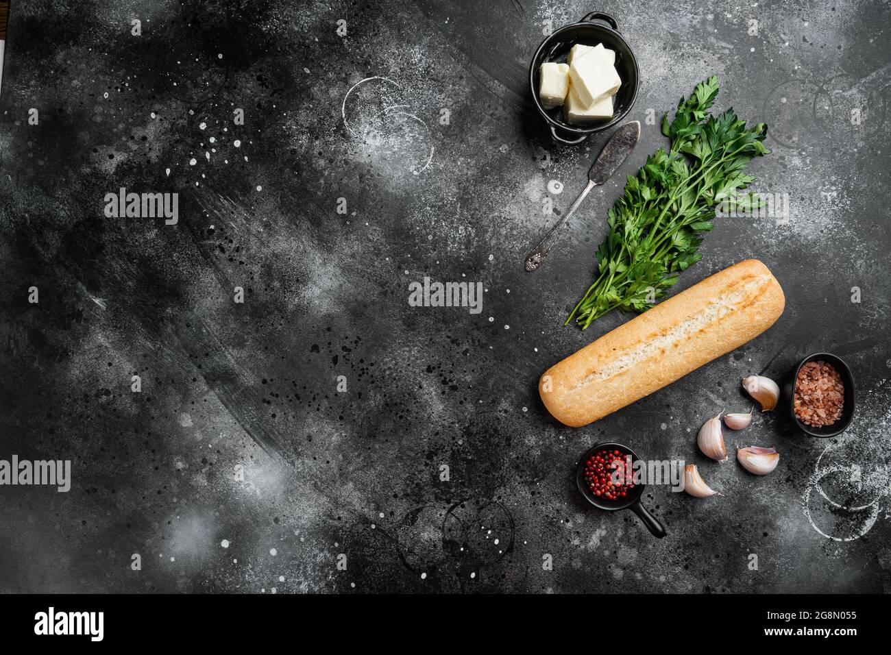 Garlic bread compound butter and herb ingredients set, on black dark ...