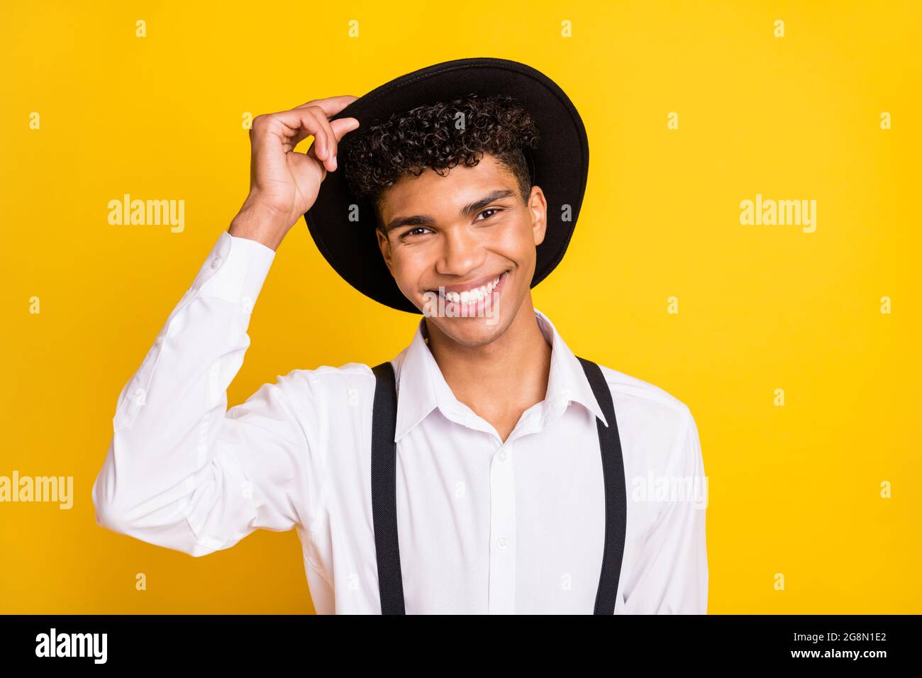 Photo portrait of african american guy tipping hat isolated on vivid ...