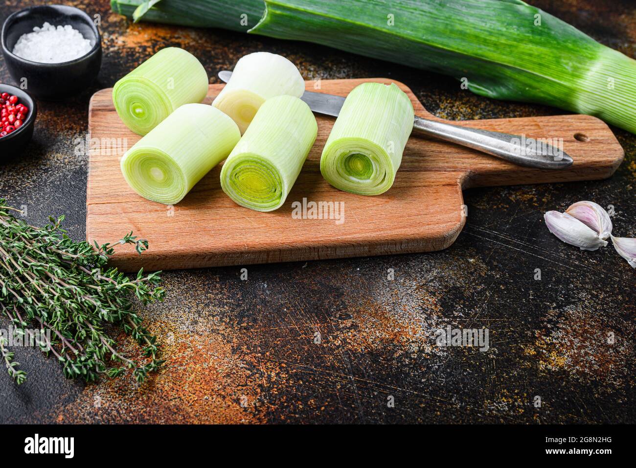 Organic chopped leek for cooking Braised Leeks on wooden board with ...