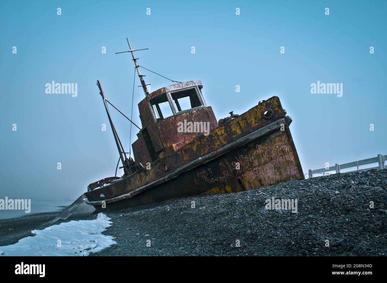 Abandoned old rusty ship on the shore Stock Photo - Alamy
