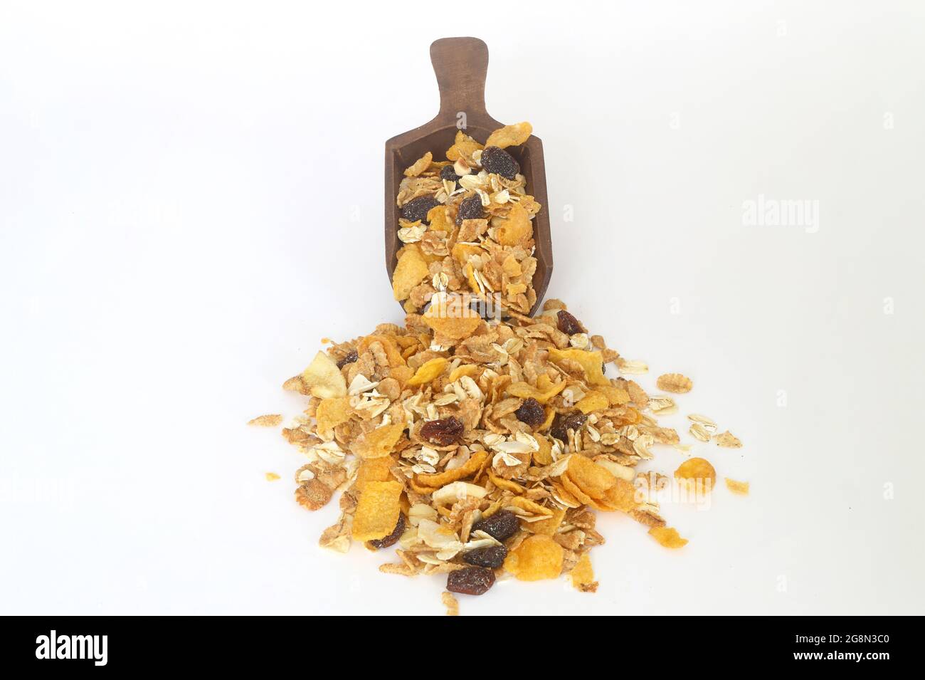 Healthy cereal breakfast. Mixed muesli in wooden scoop isolated on ...