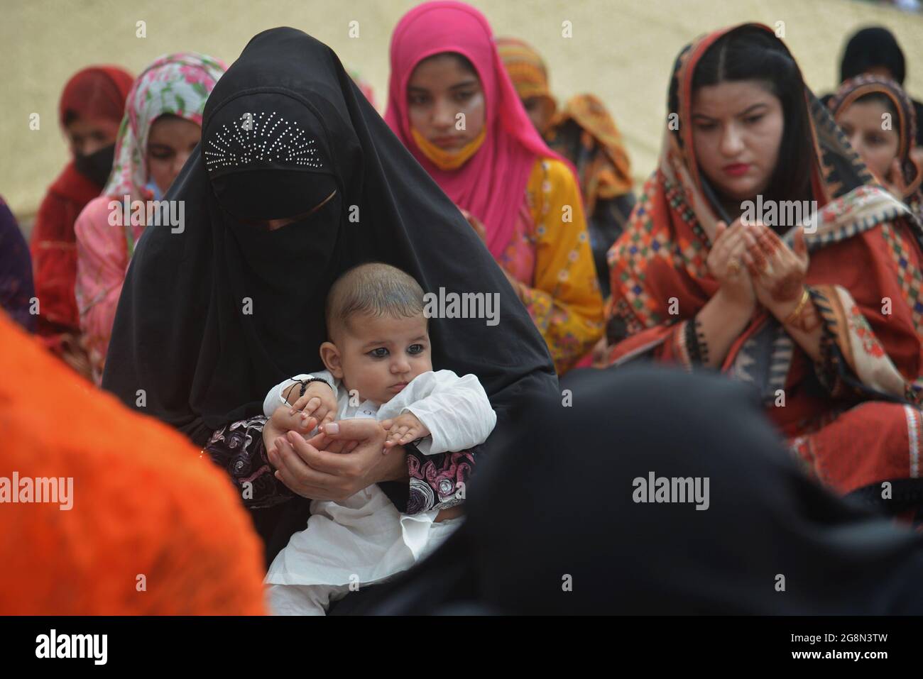 Lahore, Pakistan. 21st July, 2021. Pakistani Muslim devotees attend Eid ...