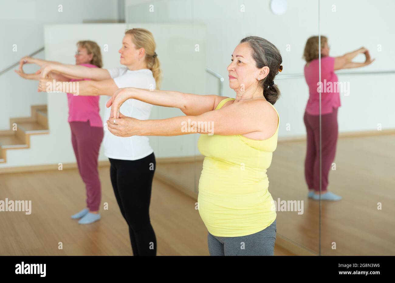Adults training swing steps at dance class Stock Photo - Alamy