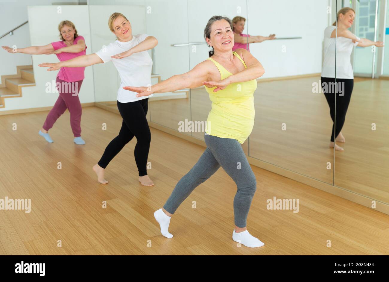 Mature women dancing aerobics at lesson in dance class Stock Photo - Alamy